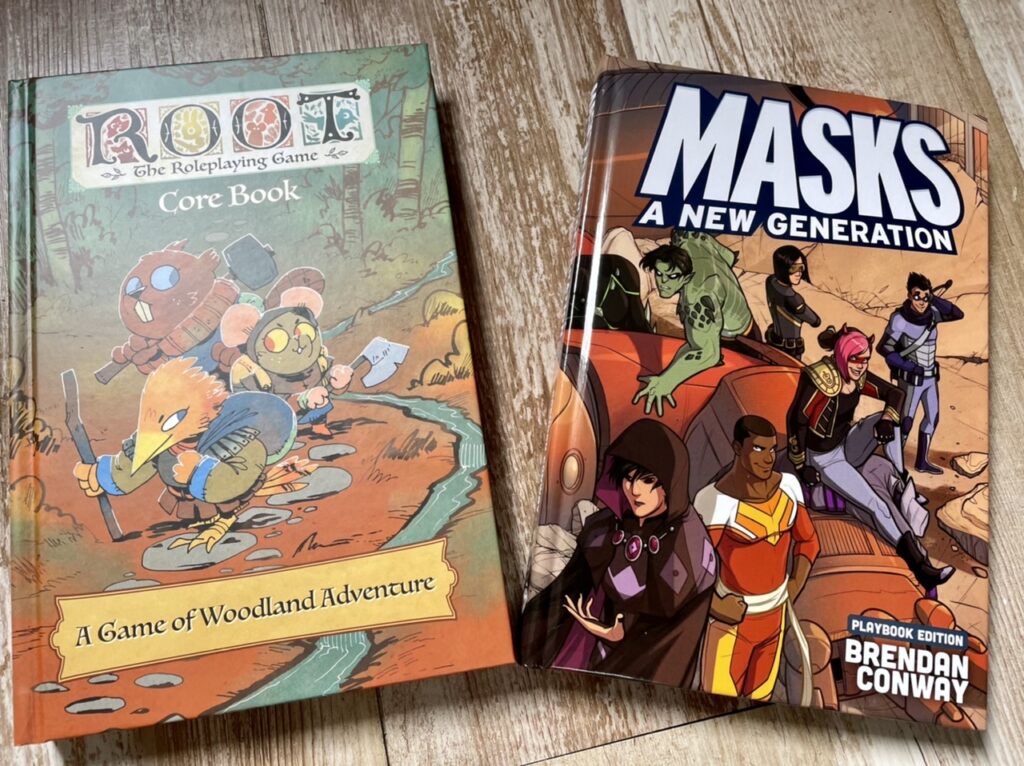 Root & Masks: A New Generation - Two RPG’s From Magpie Games.